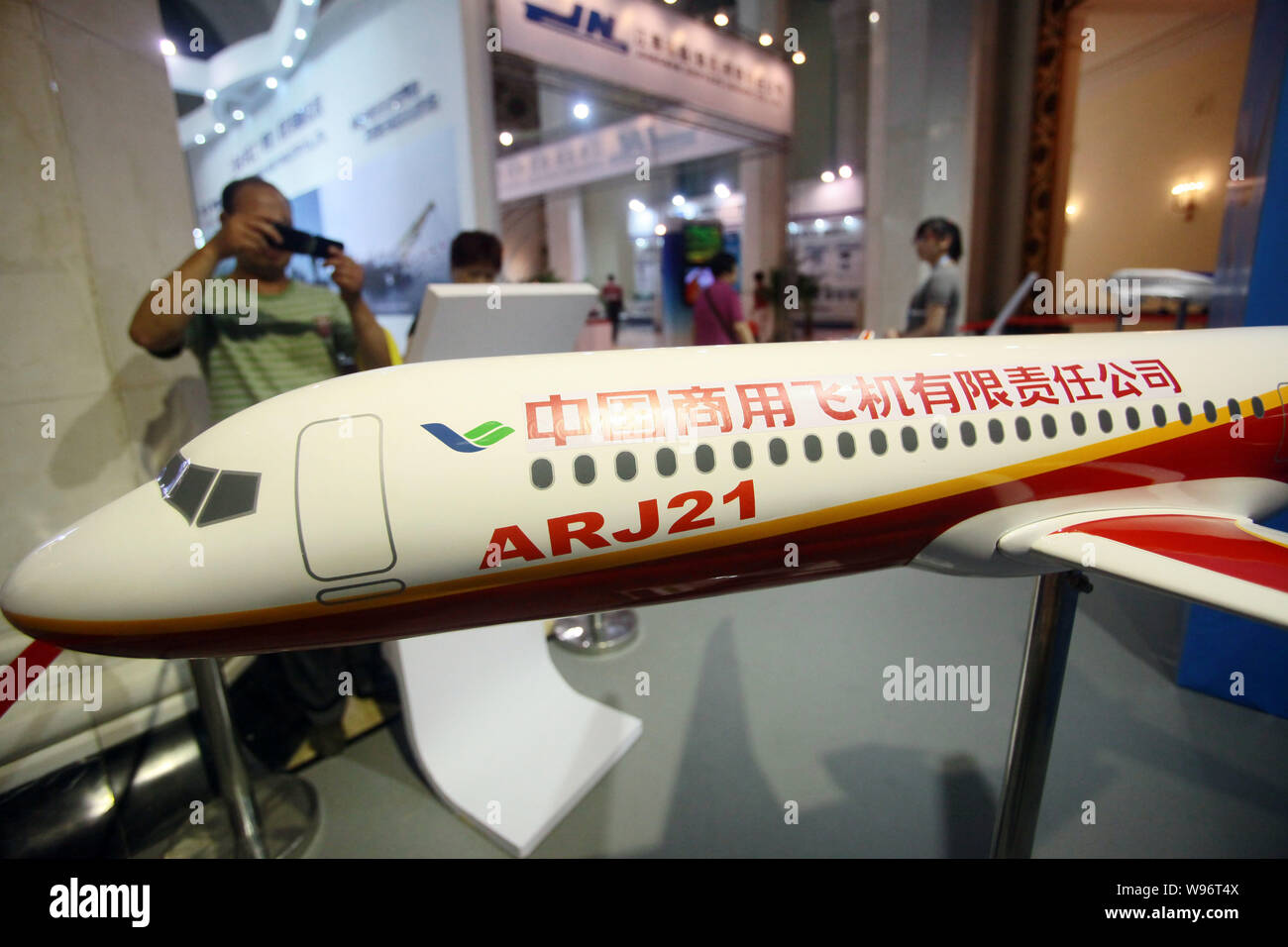 --FILE--A model of the ARJ21 regional jet is displayed at the stand of ...