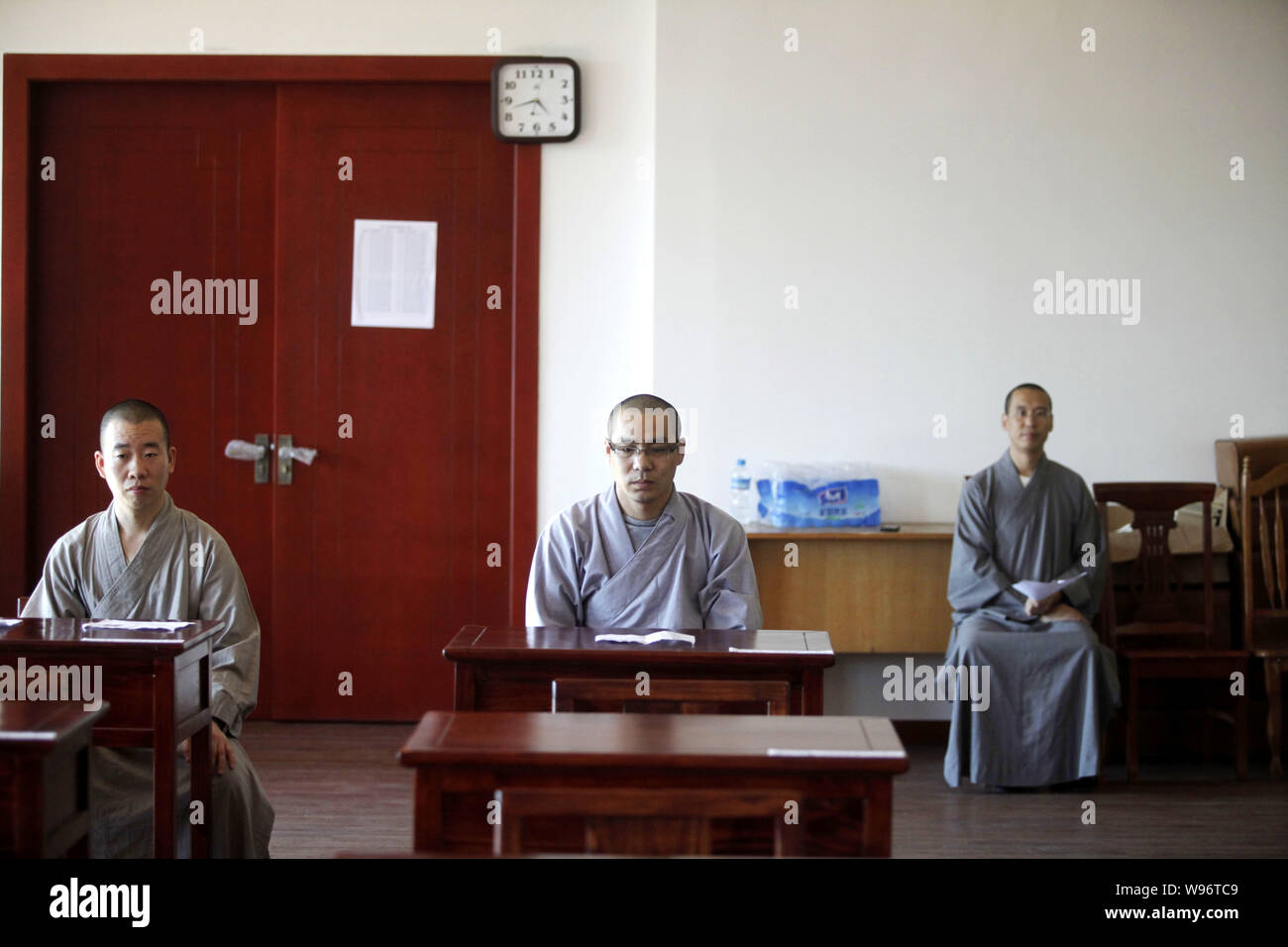 Chinese buddhist monks wait for interviews during a recruitment of the ...
