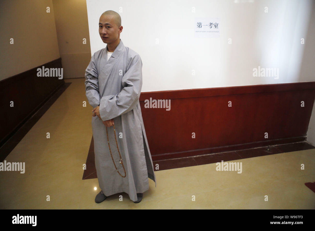 A Chinese buddhist monk waits for an interview during a recruitment of ...