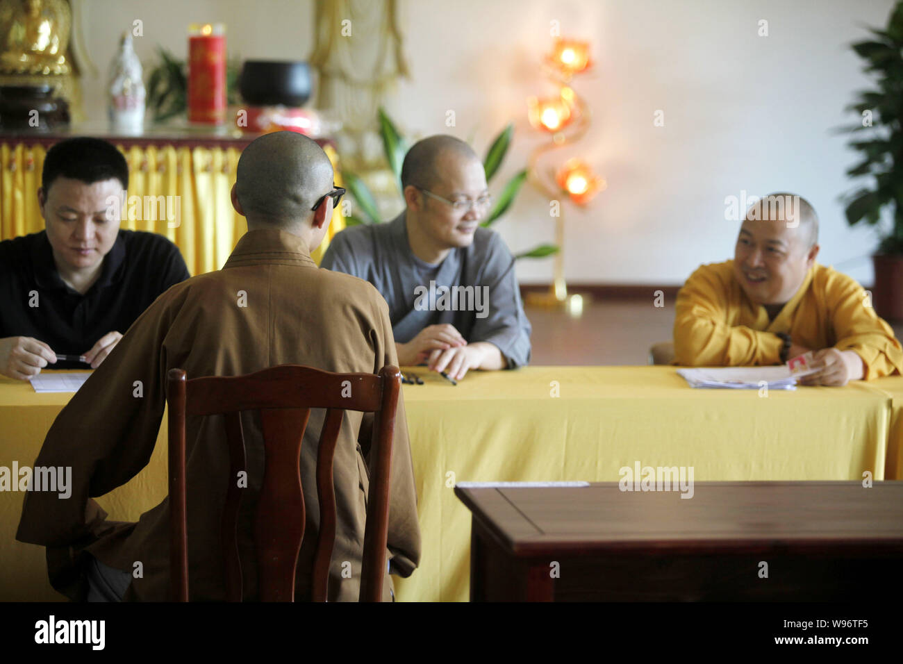 A Chinese buddhist monk is being interviewed during a recruitment of ...