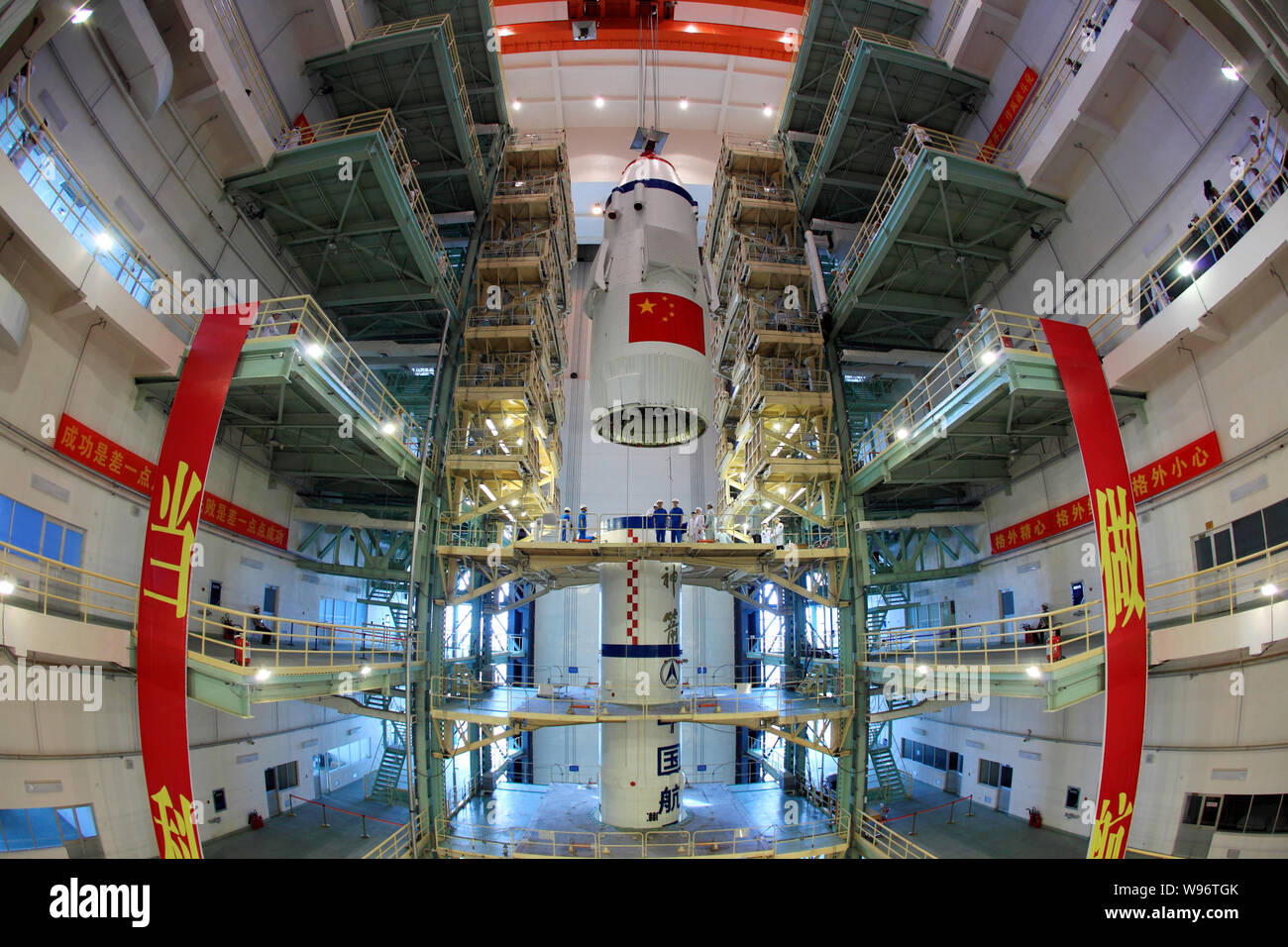 The Shenzhou-9 (Shenzhou IX) spacecraft is being lifted before being ...