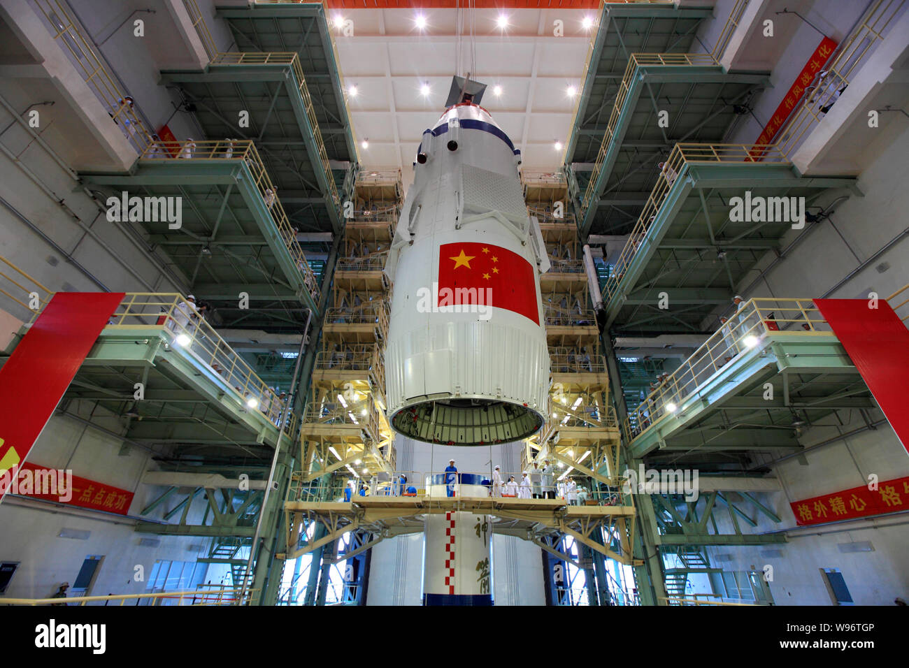 The Shenzhou-9 (Shenzhou IX) spacecraft is being lifted before being ...