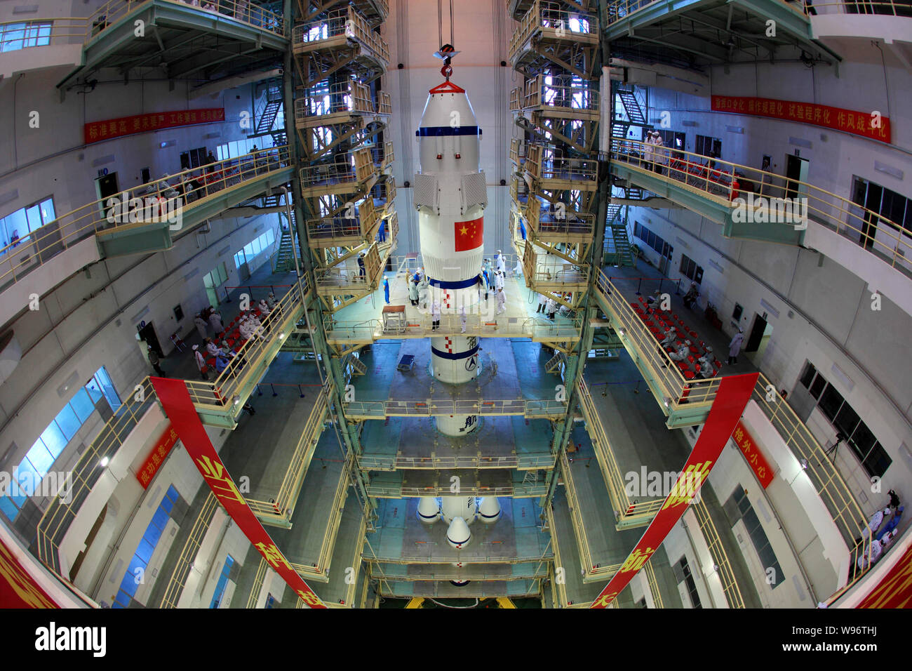 The Shenzhou-9 (Shenzhou IX) spacecraft is being installed on a Long ...