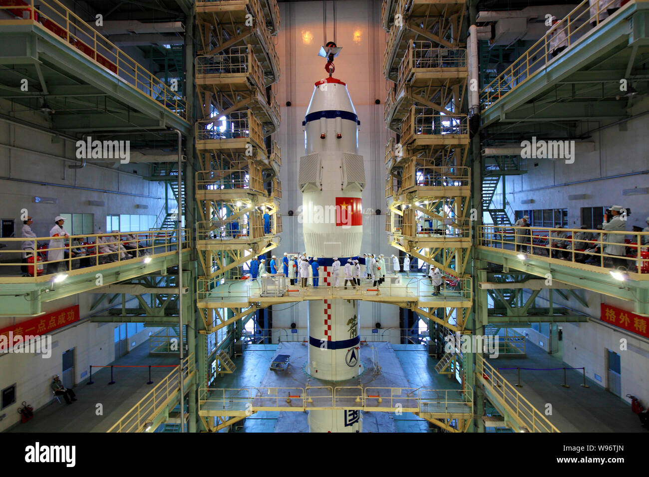 The Shenzhou-9 (Shenzhou IX) spacecraft is being installed on a Long ...