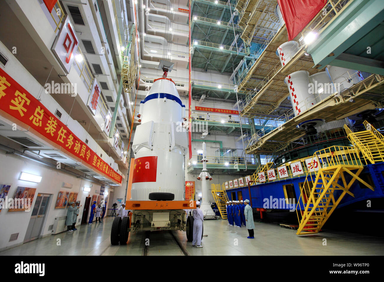 The Shenzhou-9 (Shenzhou IX) spacecraft is being lifted before being ...