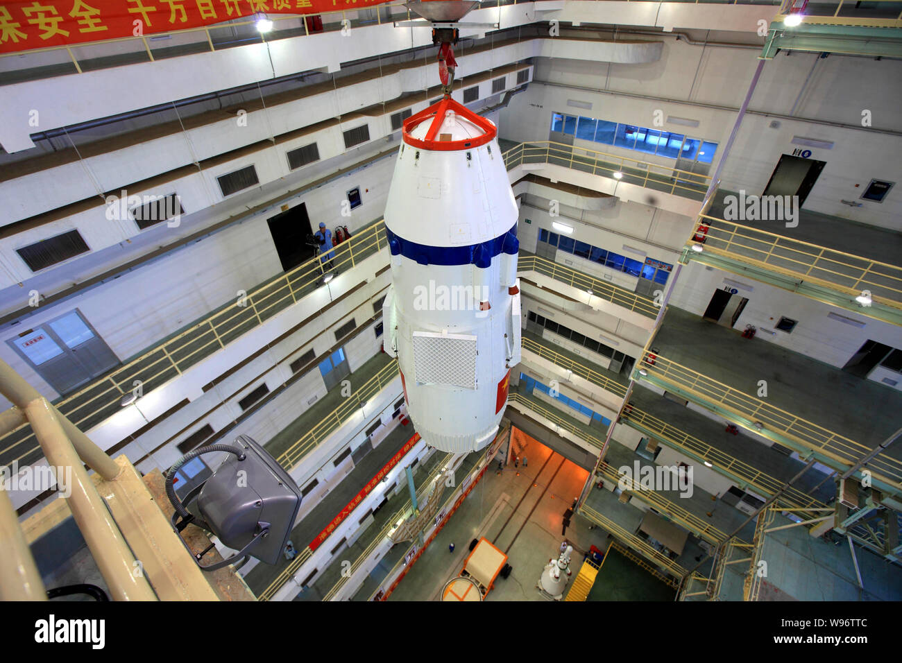 The Shenzhou-9 (Shenzhou IX) spacecraft is being lifted before being ...