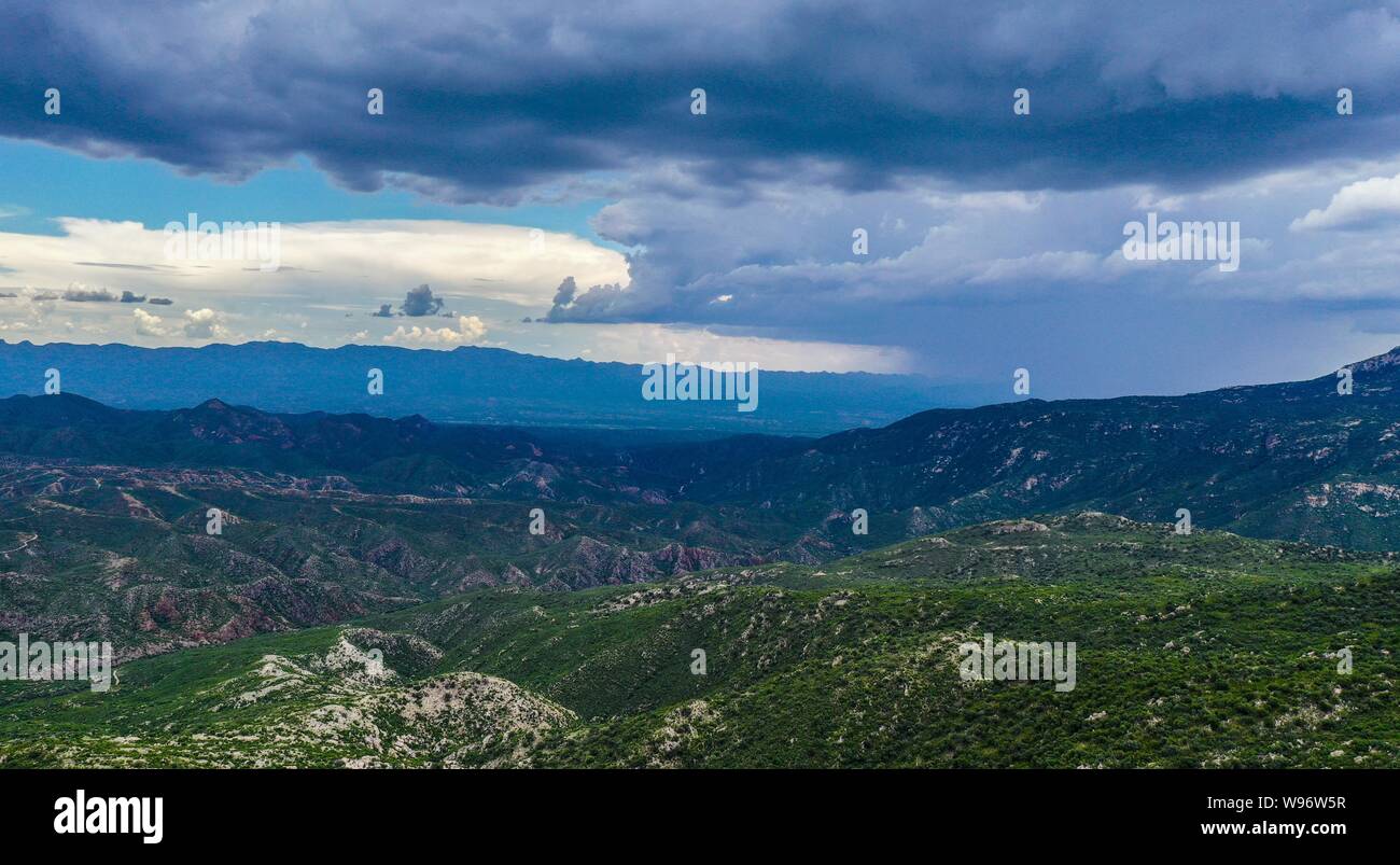 landscape area, sky, and clouds view of the Los Locos mountains in ...