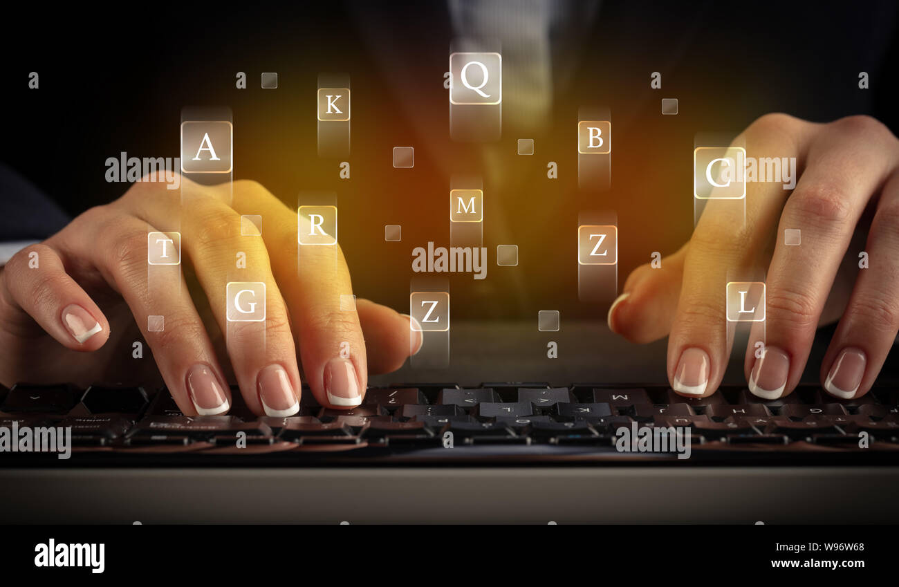 Business woman typing on keyboard with letters around Stock Photo - Alamy