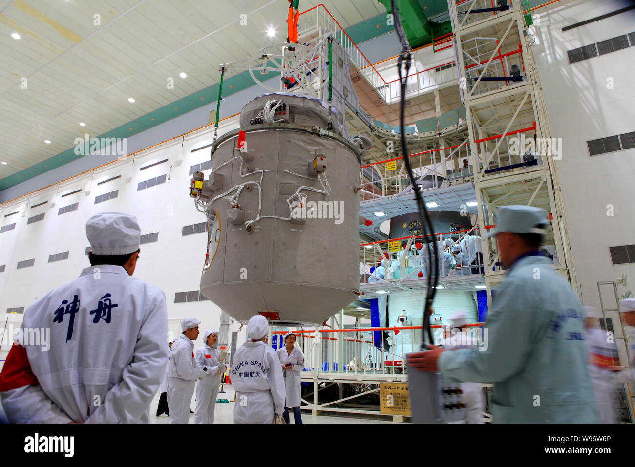 Chinese aerospace engineers look at the orbital module of the Shenzhou ...