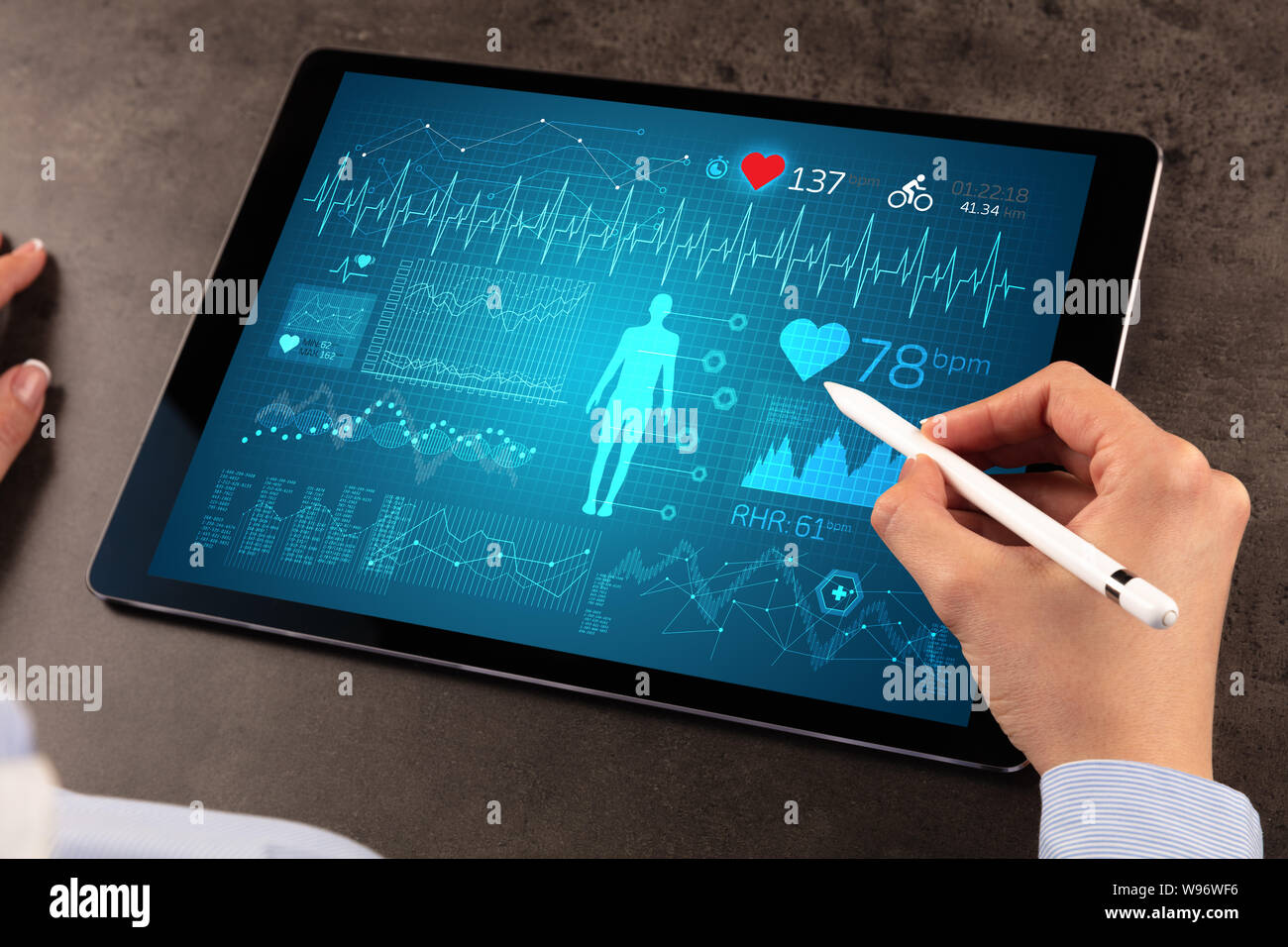 Business woman making healthy analysis on tablet Stock Photo - Alamy