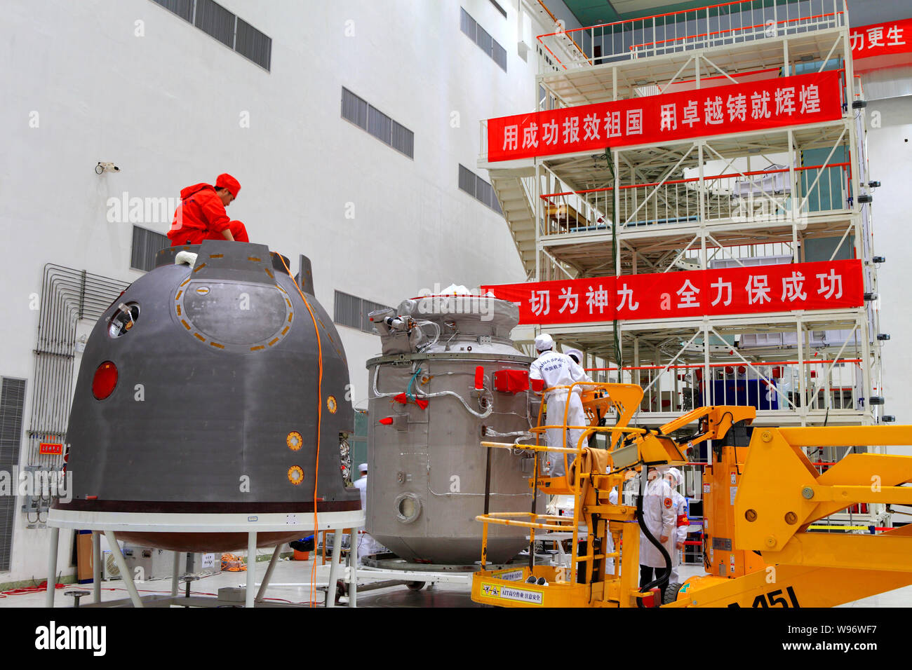 Chinese aerospace engineers check the orbital and re-entry modules of ...