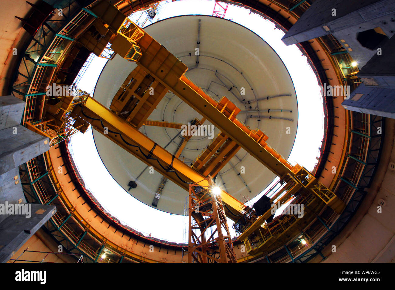 A dome is being hoisted on to the containment structure for the No.1 reactor of the ...