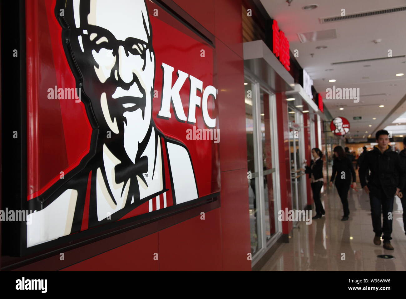 --File--Pedestrians walk past a KFC restaurant in Qingdao city, east ...