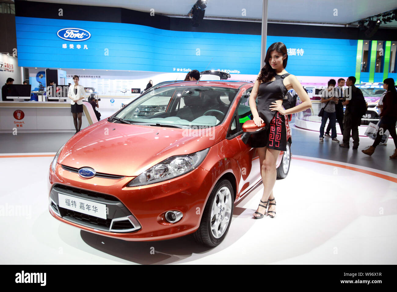 --FILE--A model poses with a Ford Fiesta during the 9th China ...