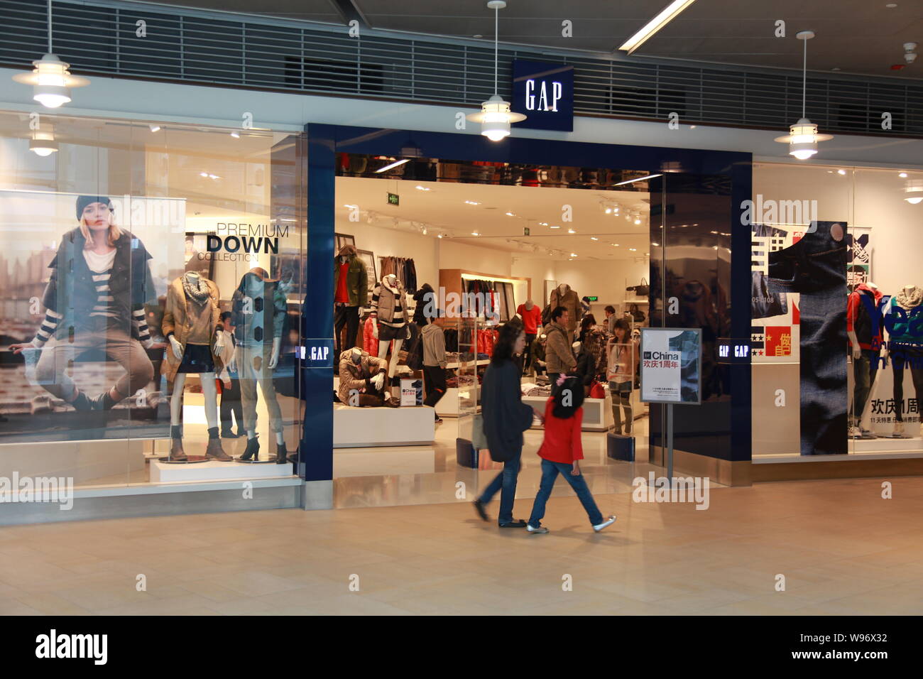 --File--Pedestrians walk past a Gap store in Shanghai, China, 6 ...