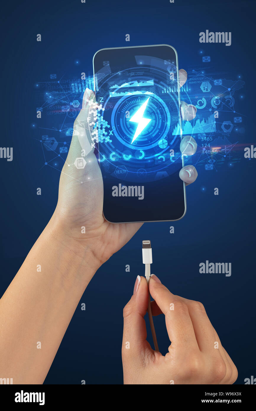 Elegant hand charging smartphone with global report concept Stock Photo ...