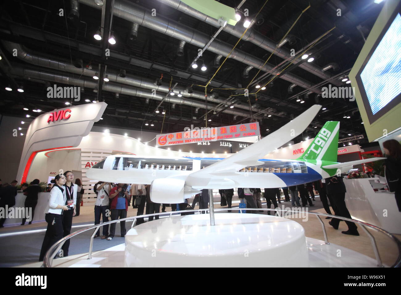 --FILE--Visitors look at a model of Chinese developed C919 jet plane of ...