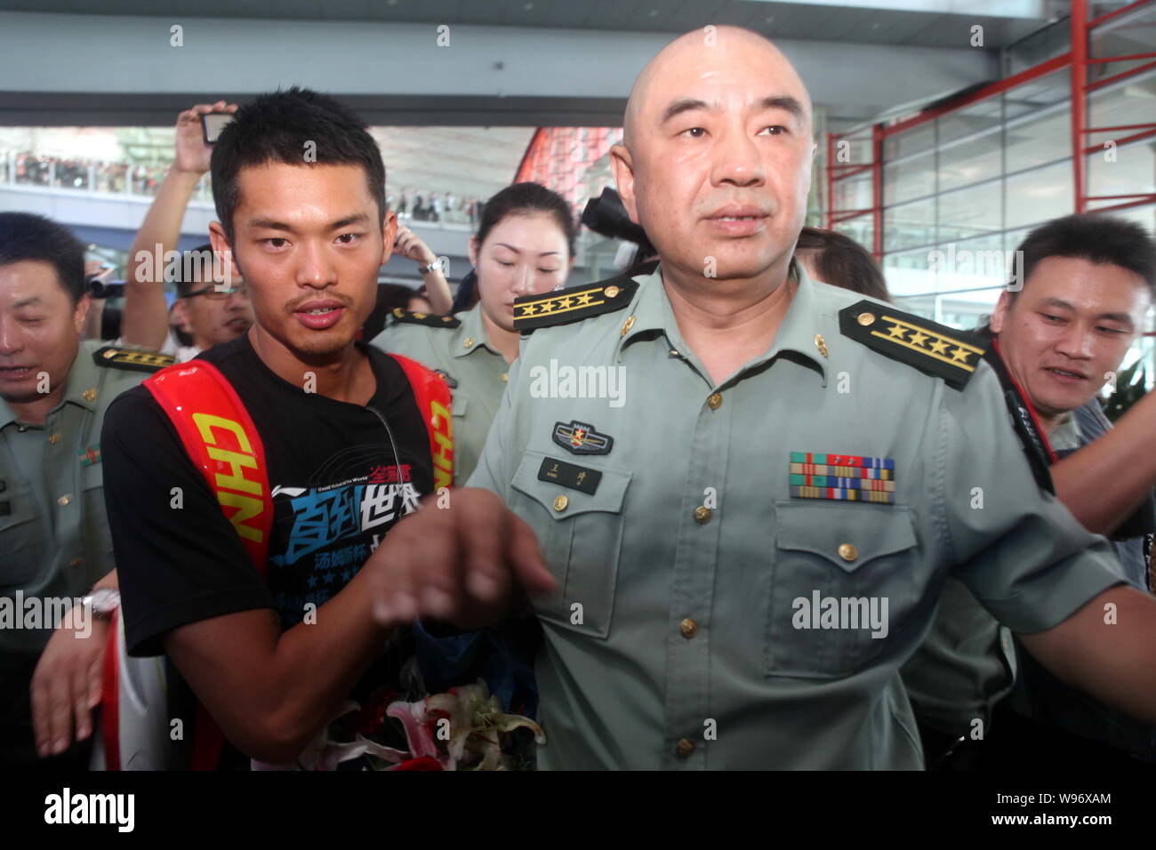 Chinese Olympic badminton champion Lin Dan (black) is pictured at the ...