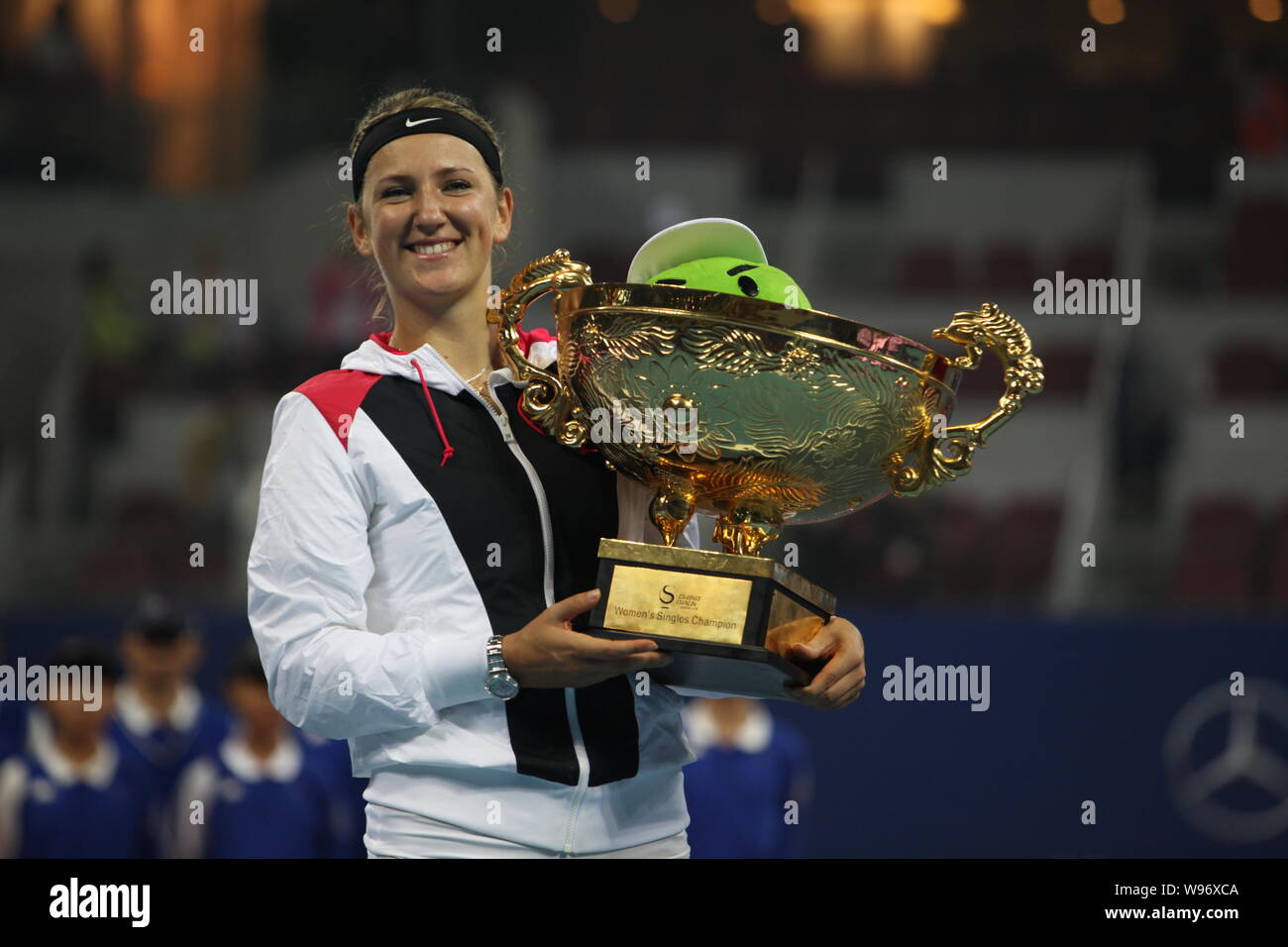 Victoria Azarenka of Belarus holds her champion trophy in the award ...