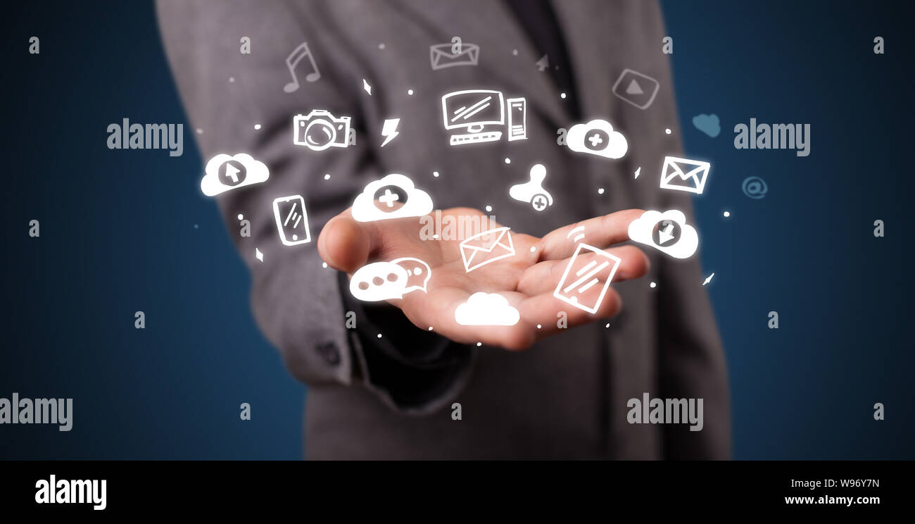 Hand holding application icons and symbols in her hand Stock Photo - Alamy