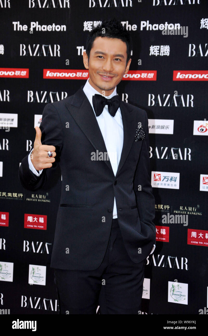 Chinese actor Huang Xiaoming poses on the red carpet as he arrives for ...
