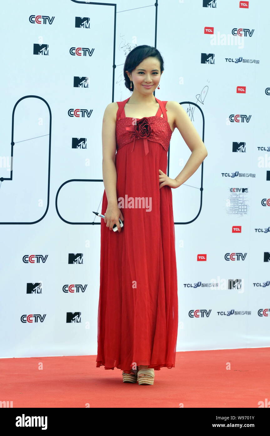 Chinese singer and actress Meng Qian poses on the stage as she arrives ...