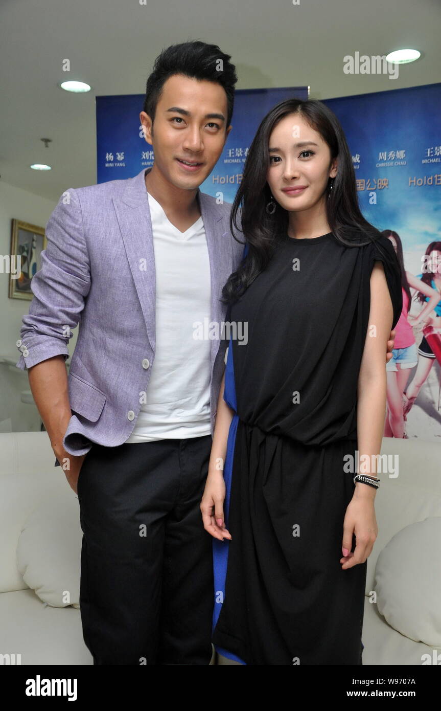Hong Kong actor Hawick Lau and Chinese actress Yang Mi pose during a press conference for their ...