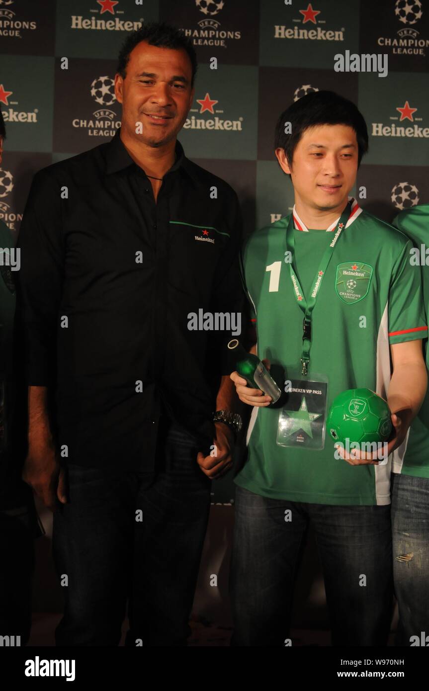 Former Dutch soccer star Ruud Gullit poses with a fan during a ...