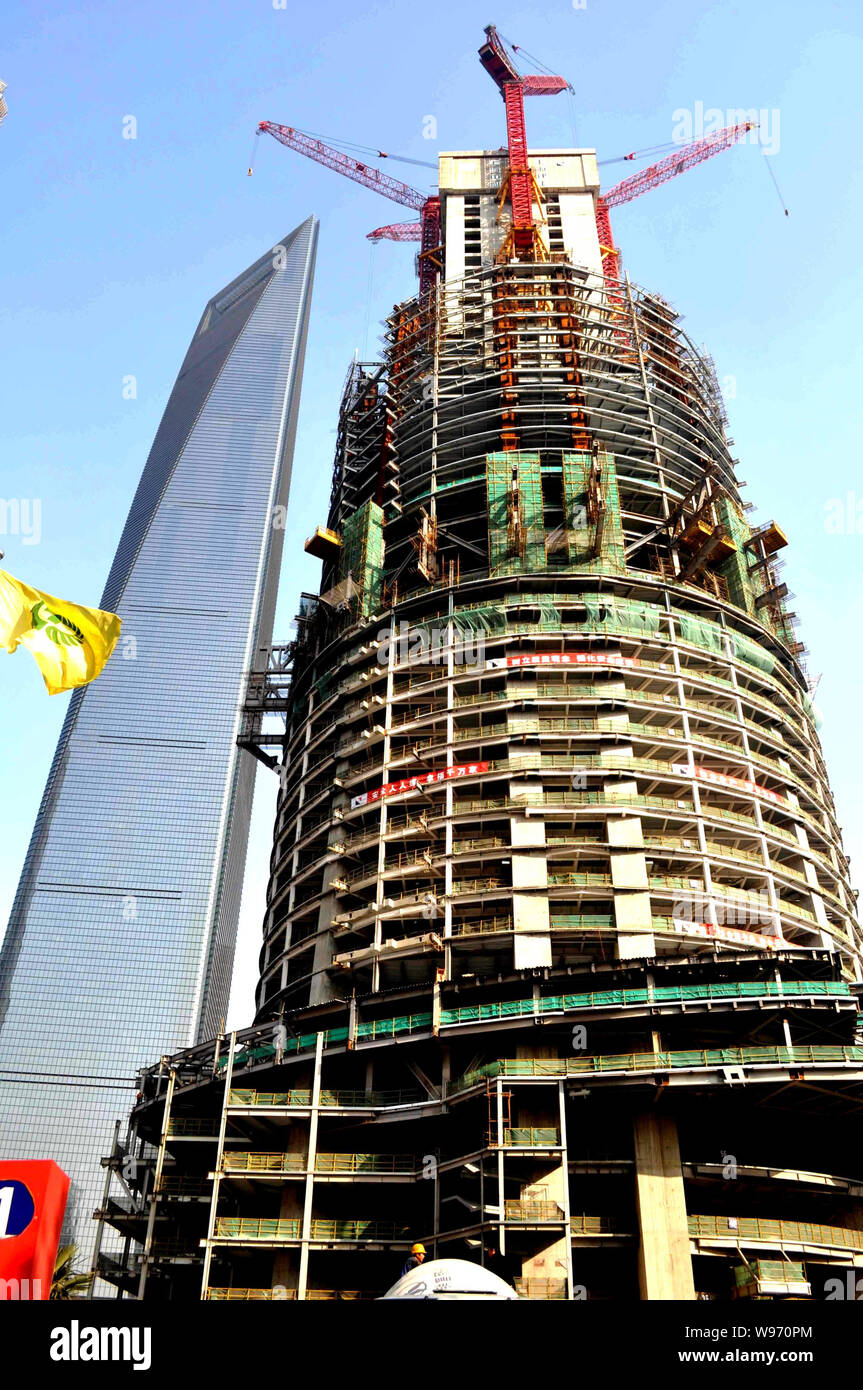 The Shanghai Tower is under construction next to the Shanghai World ...