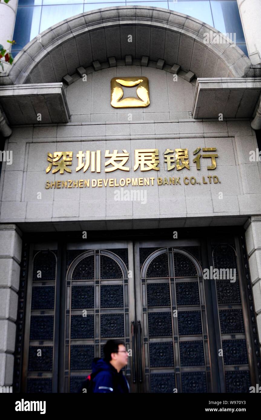 --File--A pedestrian walks past a branch of Shenzhen Development Bank ...