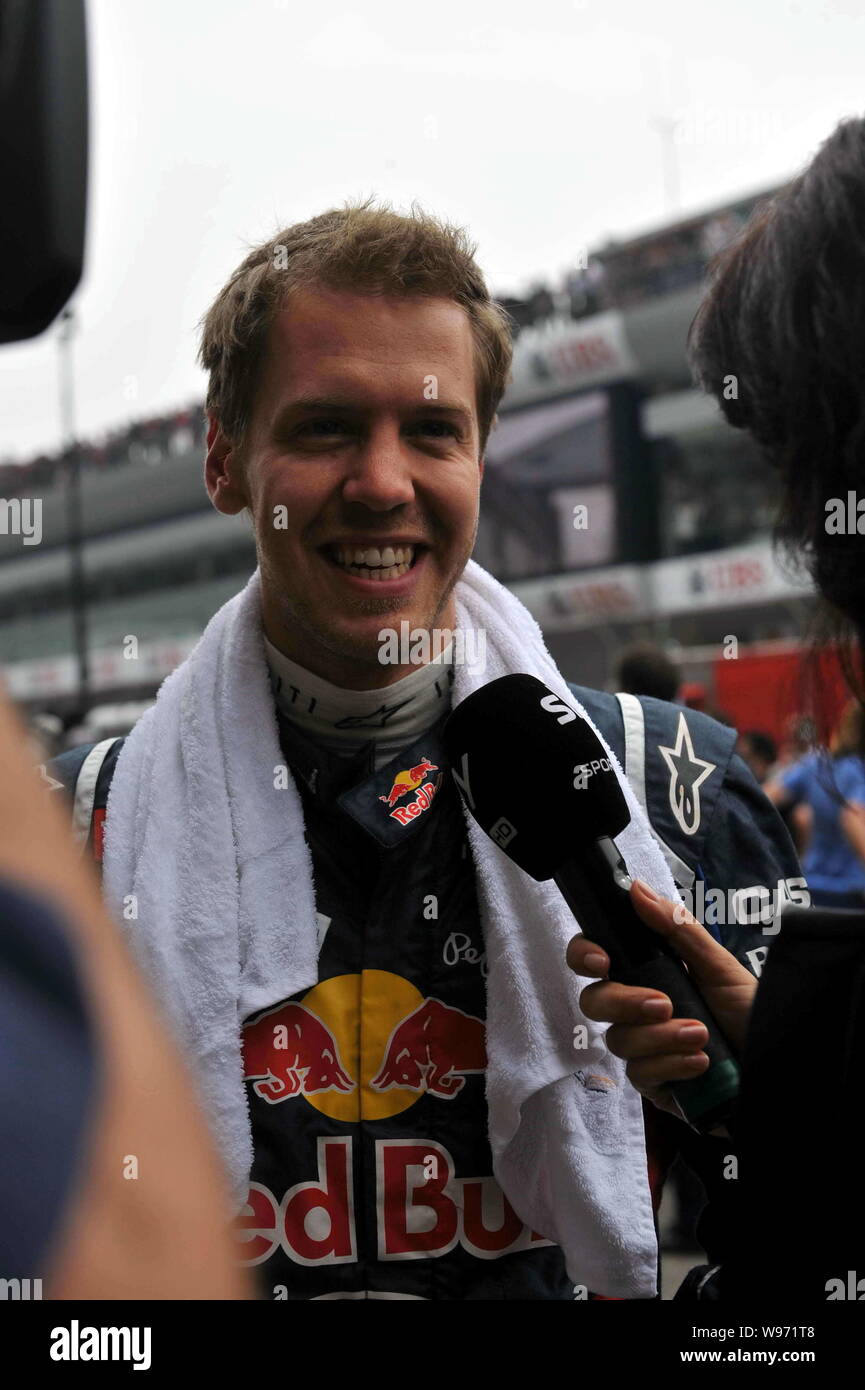 German F1 driver Sebastian Vettel of the Red Bull team is interviewed ...