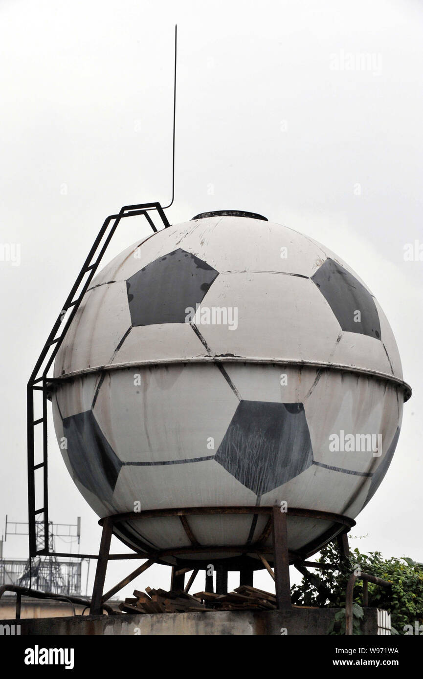 A football-shaped water tank supplying tap water is pictured on the ...
