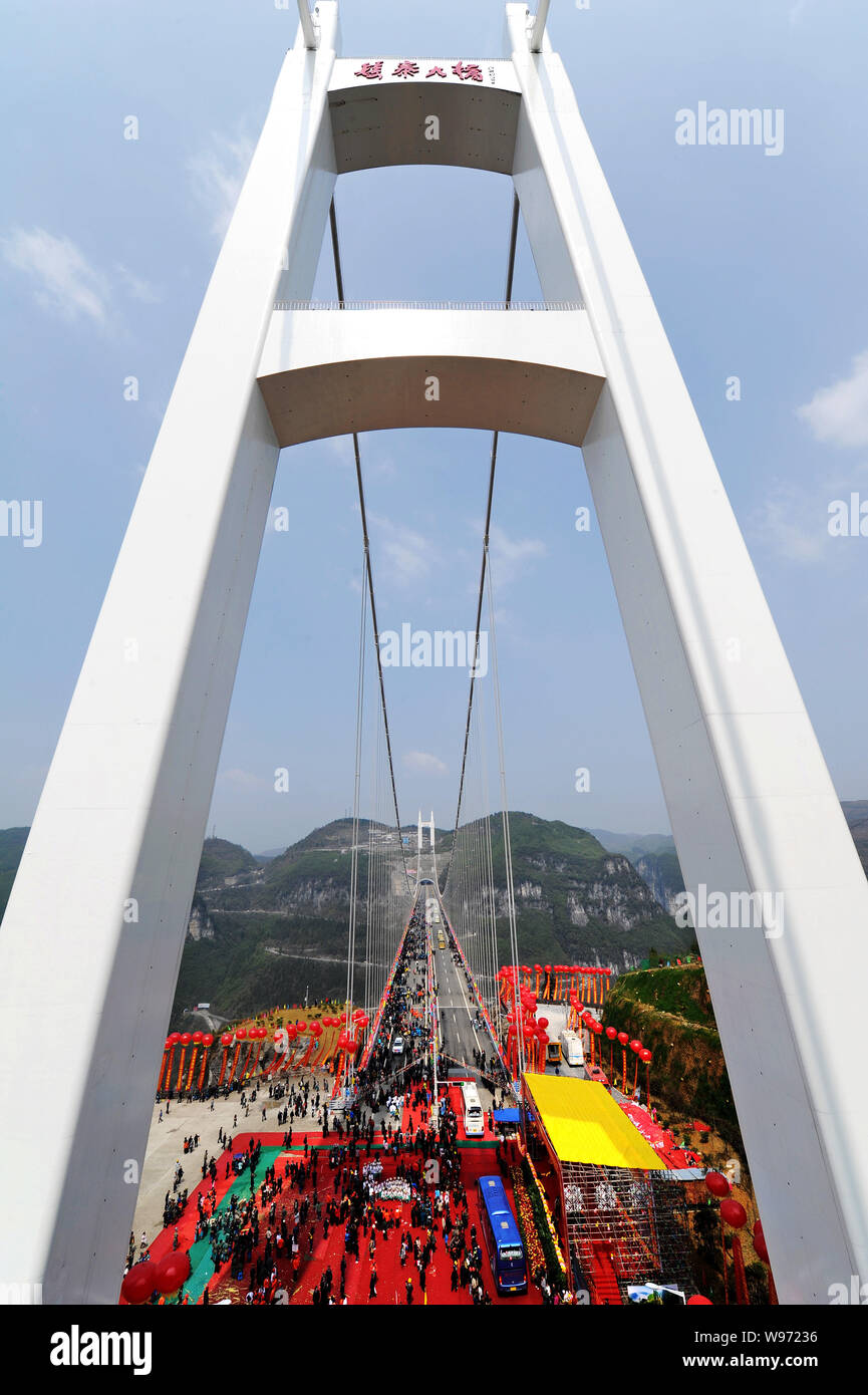 Visitors pass through Aizhai Suspension Bridge in Aizhai town, Jishou ...