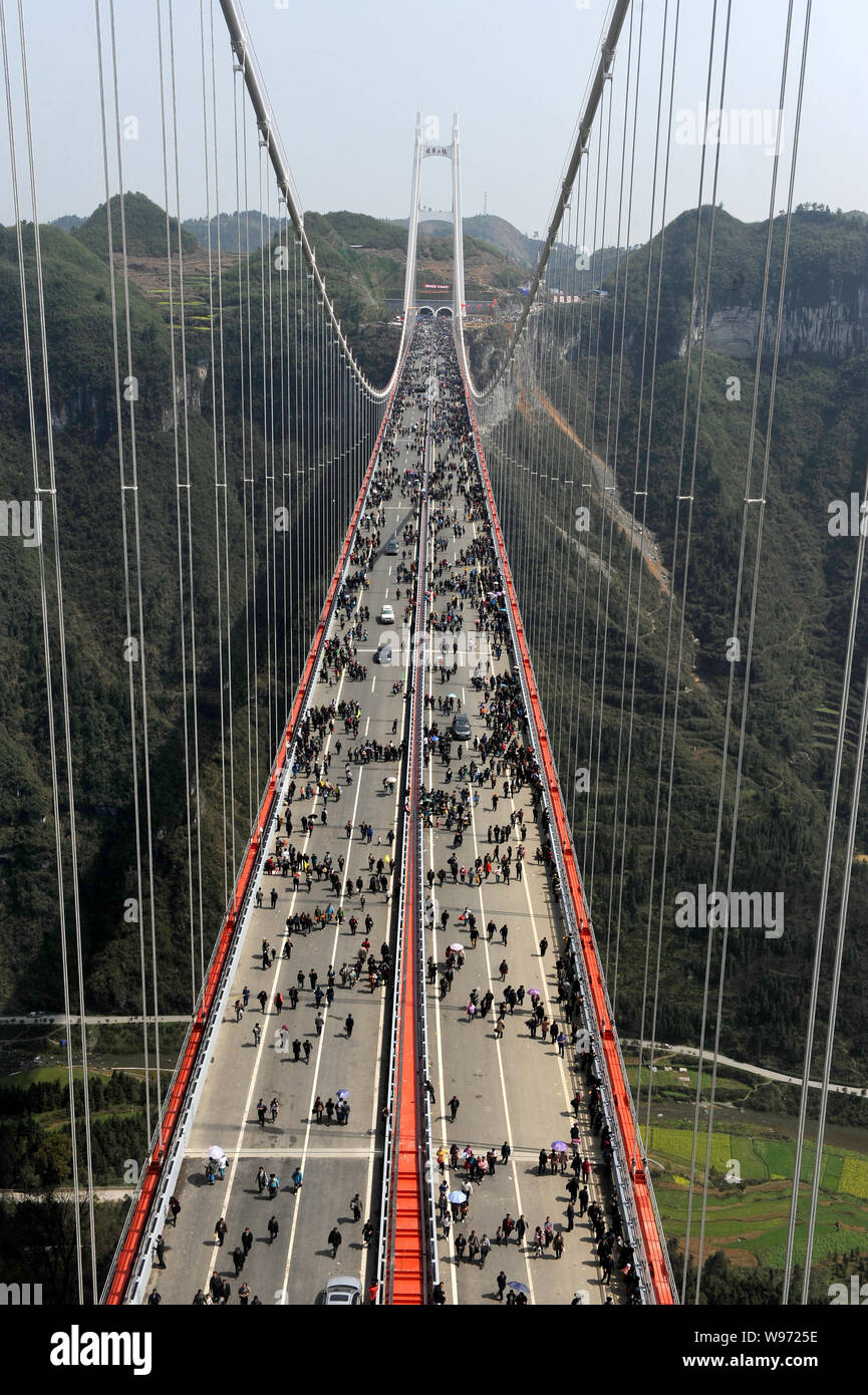 Visitors pass through Aizhai Suspension Bridge in Aizhai town, Jishou ...