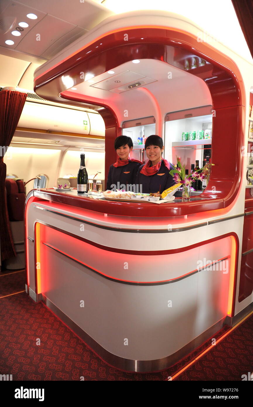 Staff are seen at the bar of the worlds first Airbus all-business class ...