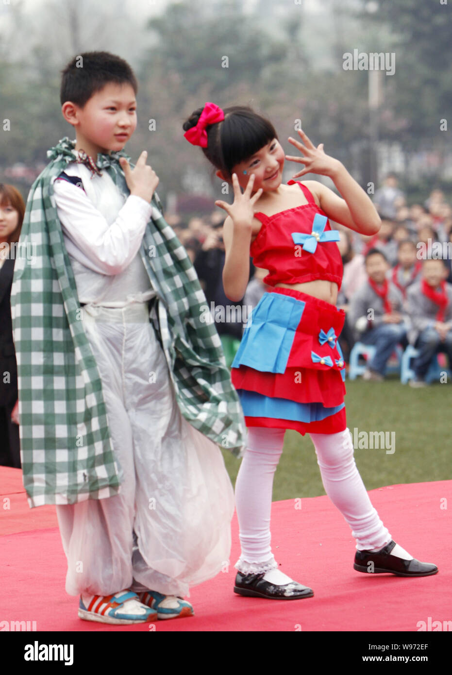 Young Chinese students pose to show new creations made with recycled ...