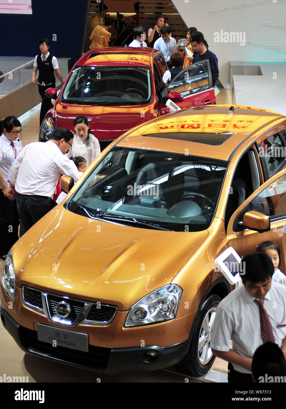 --FILE--Visitors look at Nissan cars during an auto show in Changzhou ...