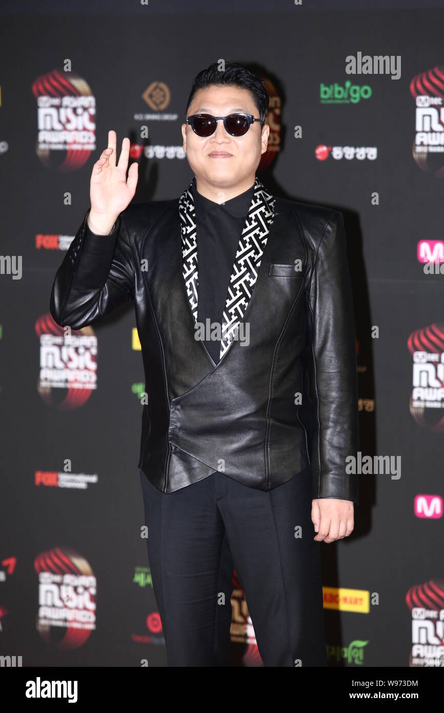 South Korean singer PSY (Park Jae-sang) waves on the red carpet as he ...