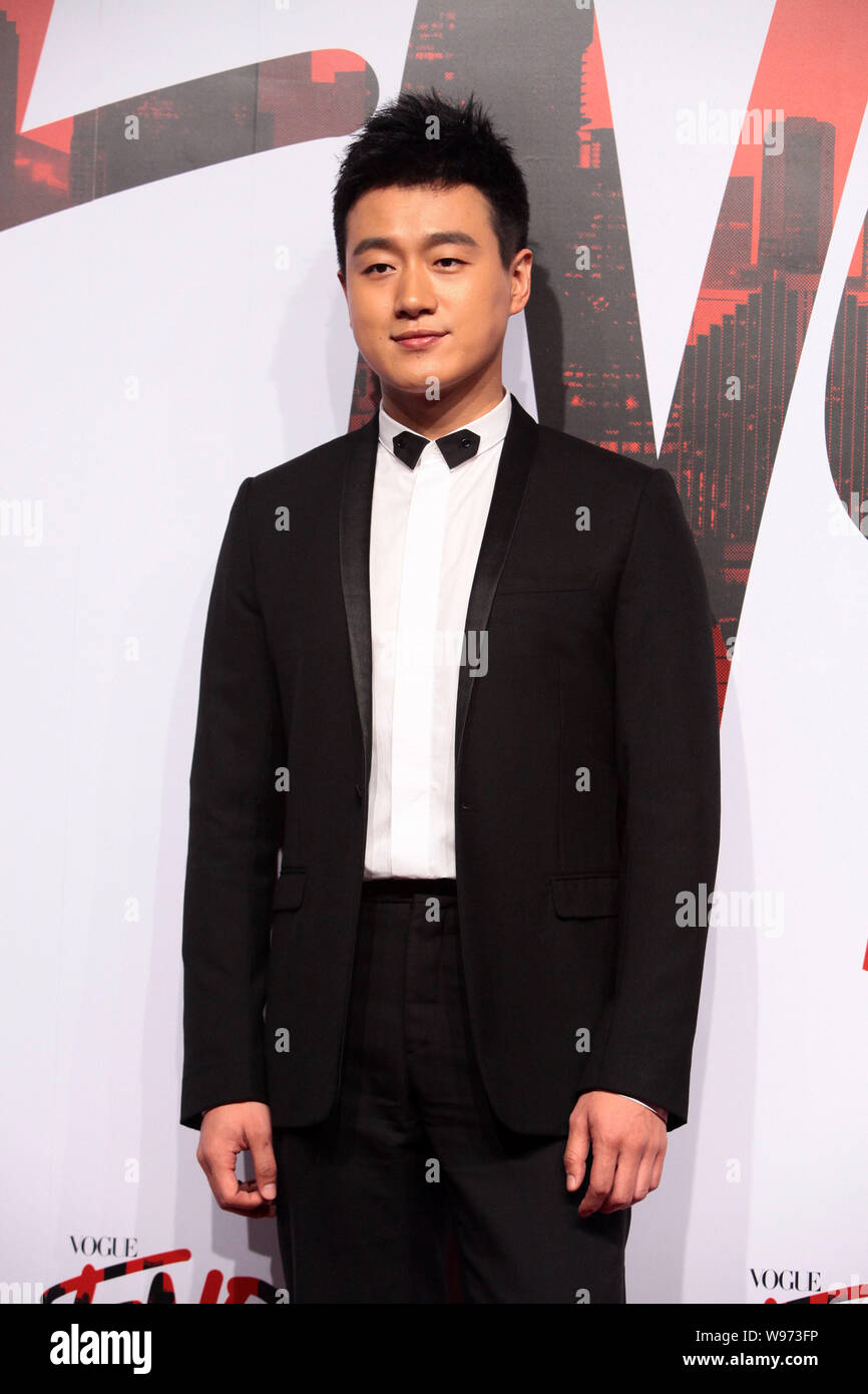 Chinese actor Tong Dawei poses on the red carpet as he arrives for the ...