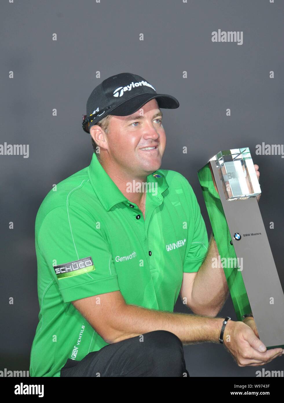 Peter Hanson of Sweden holds his champion trophy during the award ...