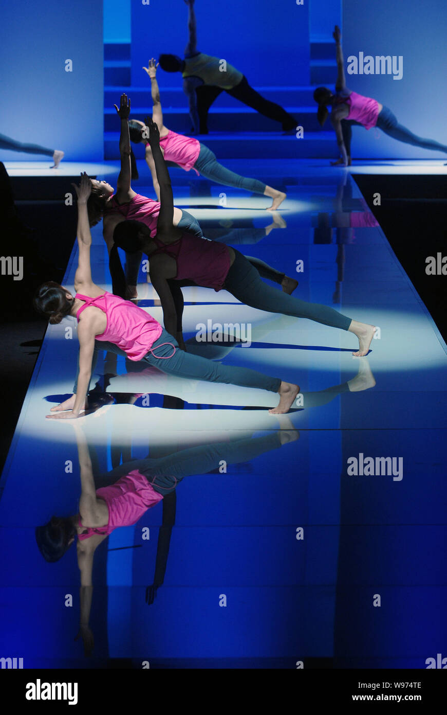 Models do body exercises as they present creations at the HOSA First ...