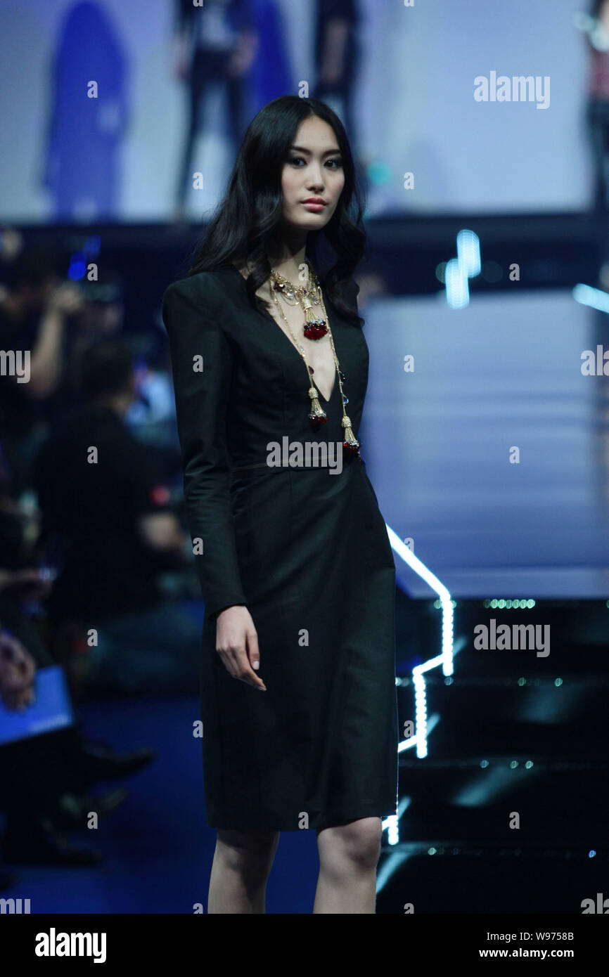 Chinese supermodel Qin Shupei poses at the stage during the opening ...