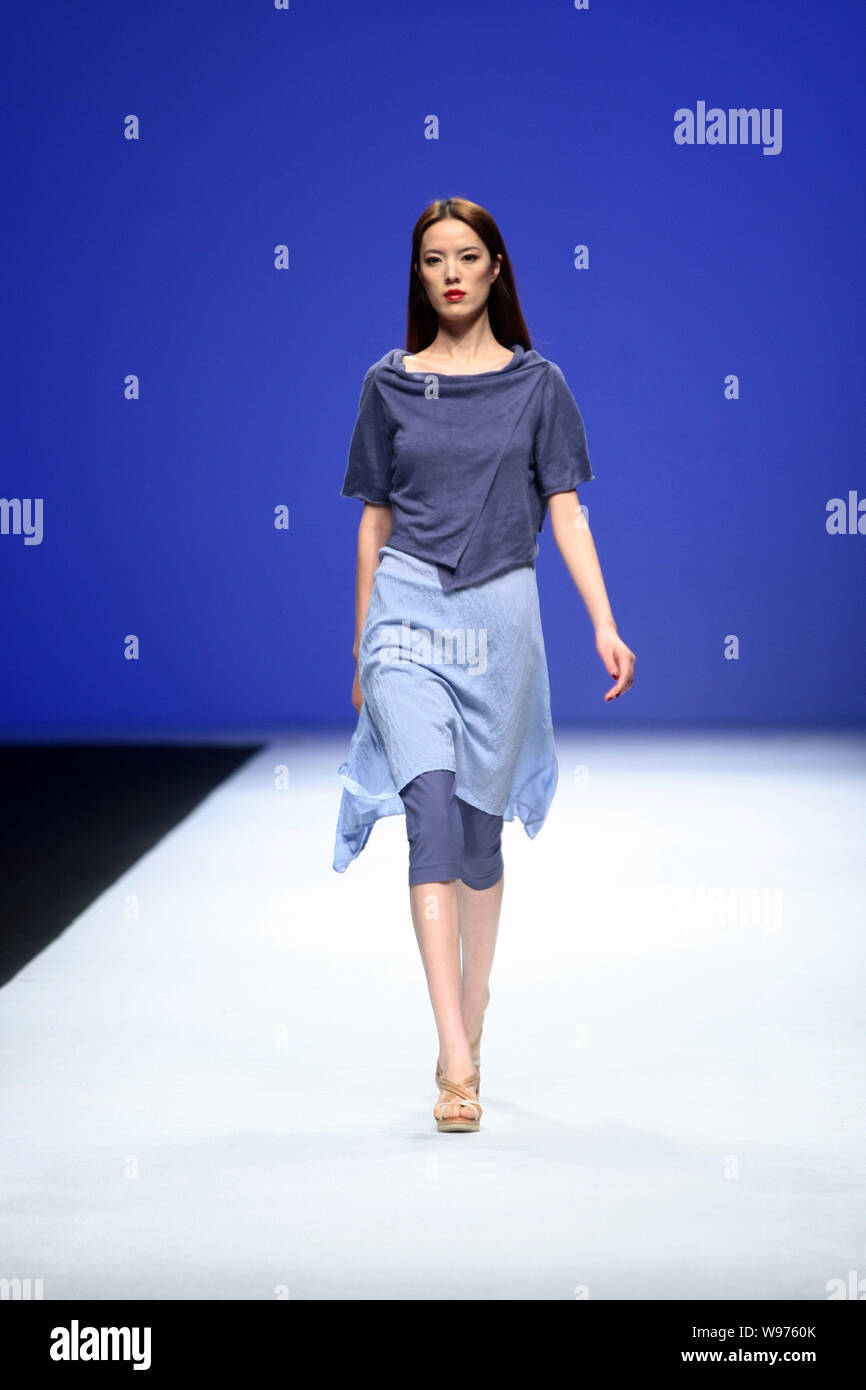 A model presents a creation from the Oska autumn/winter collection ...
