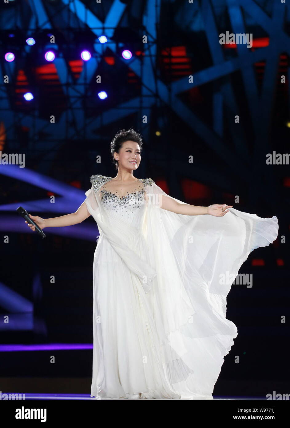 Chinese singer Tan Jing performs during a gala celebrating the triumph ...