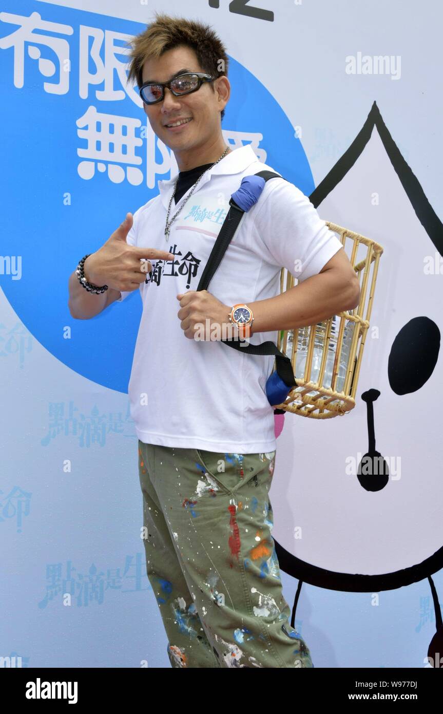 Taiwanese singer and actor Richie Jen poses during a public welfare ...