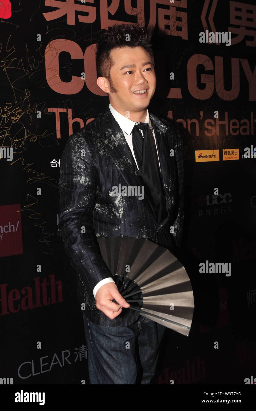Chinese hairstylist Tony Lee poses on the red carpet as he arrives for ...