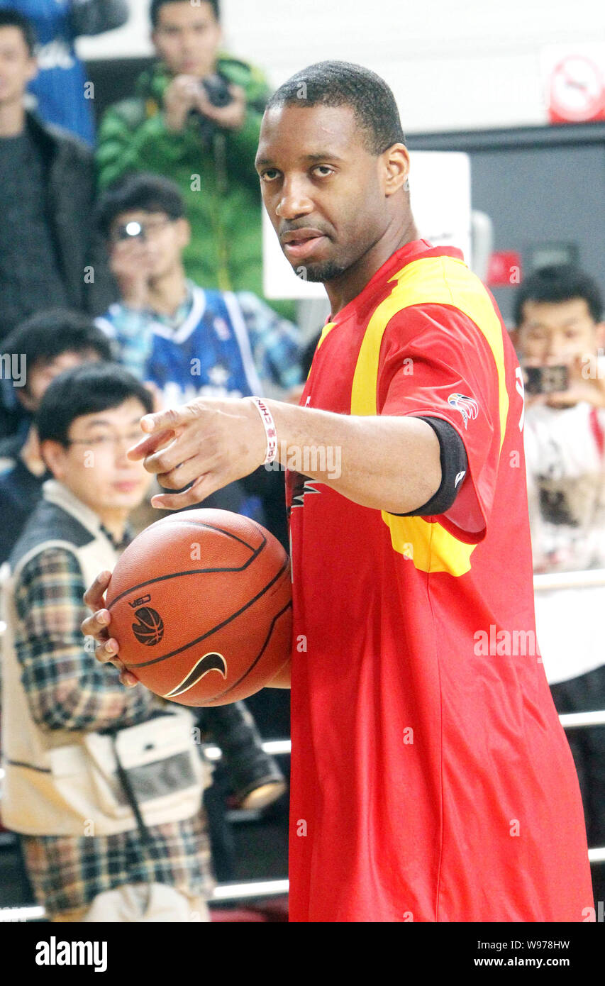 Tracy McGrady of the Qingdao Eagles gestures as he warms up before the ...