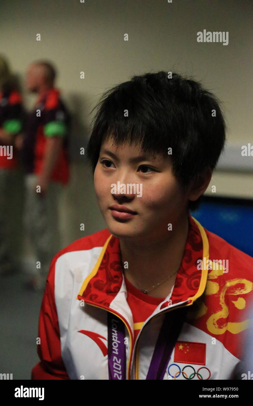 Gold medalist Chen Ruolin of China is interviewed after she and Wang ...