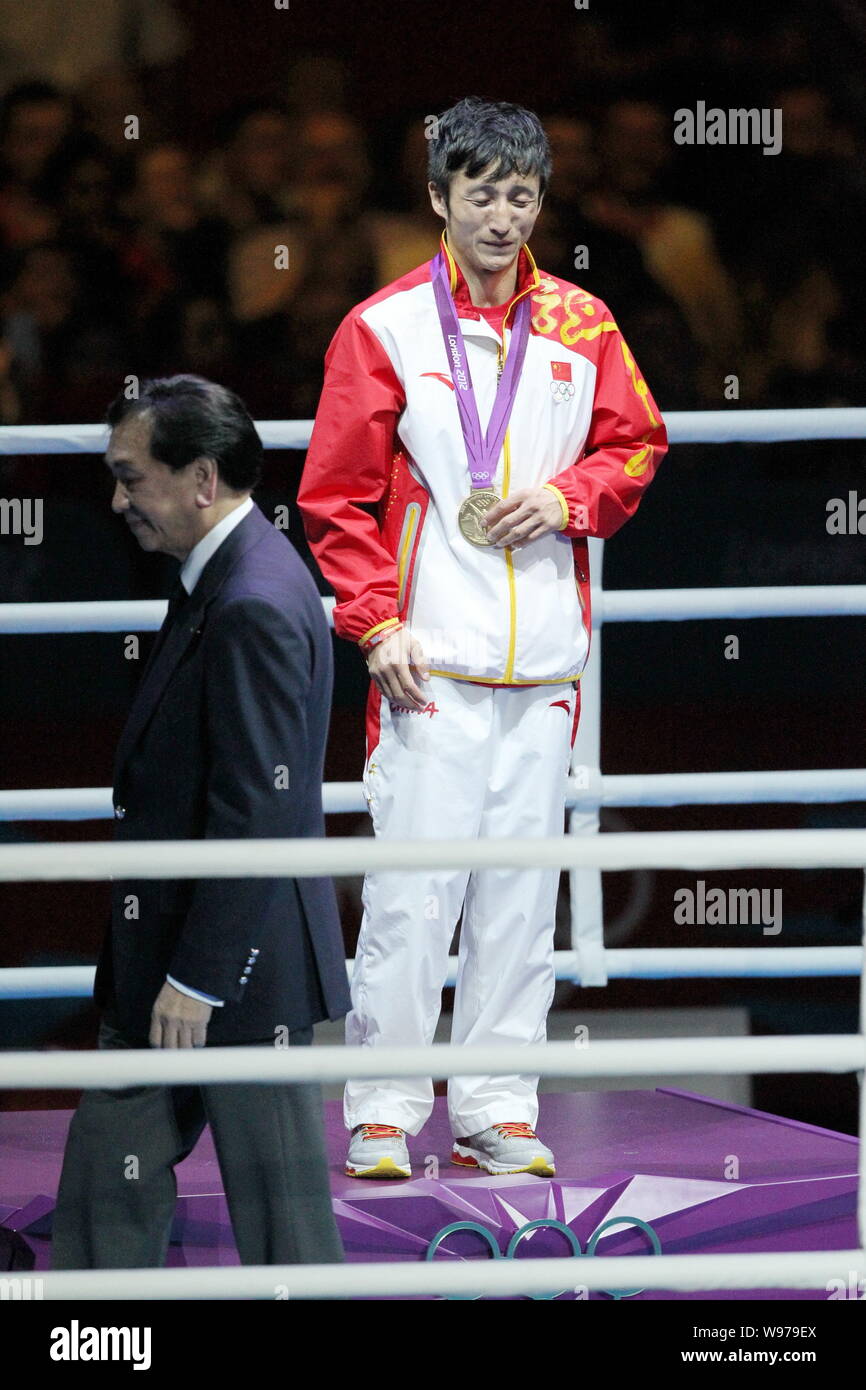 Gold medalist Zou Shiming of China poses in the award ceremony of the ...