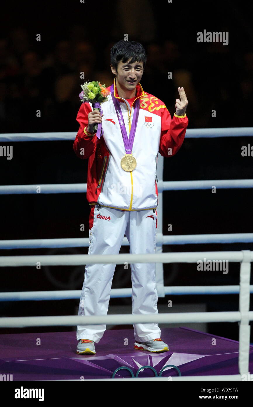 Gold medalist Zou Shiming of China poses in the award ceremony of the ...